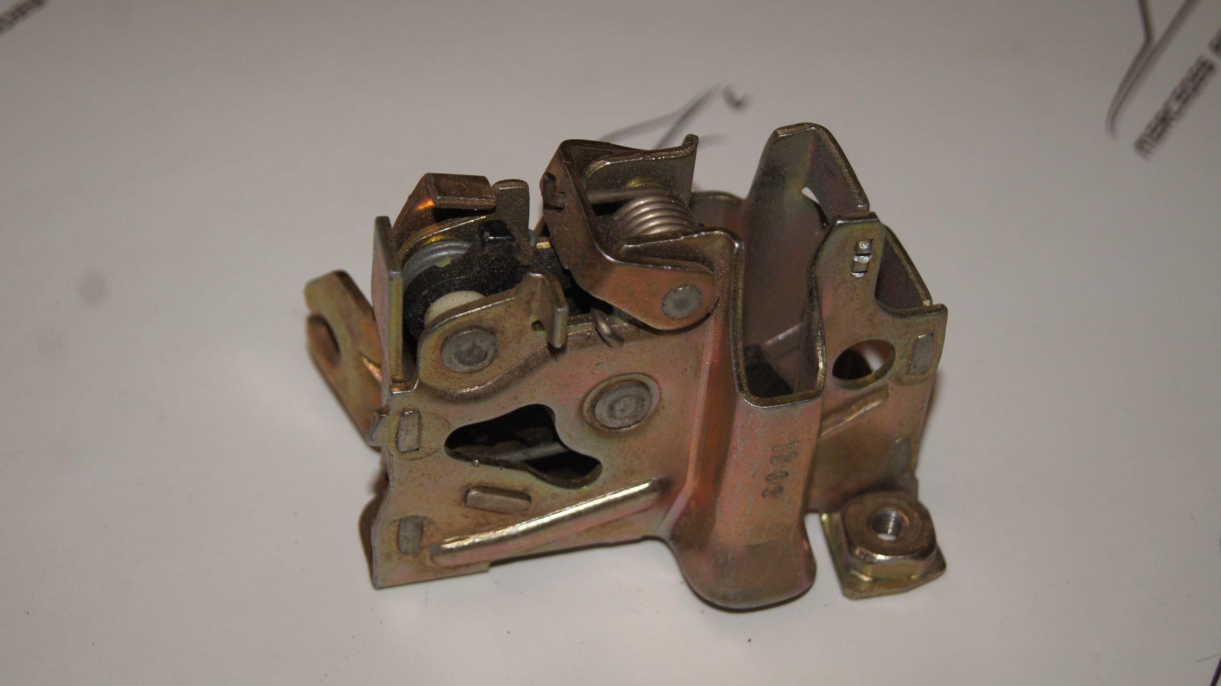 A1268801160 W126 engine hood lower left part hood latch - mercedespartz