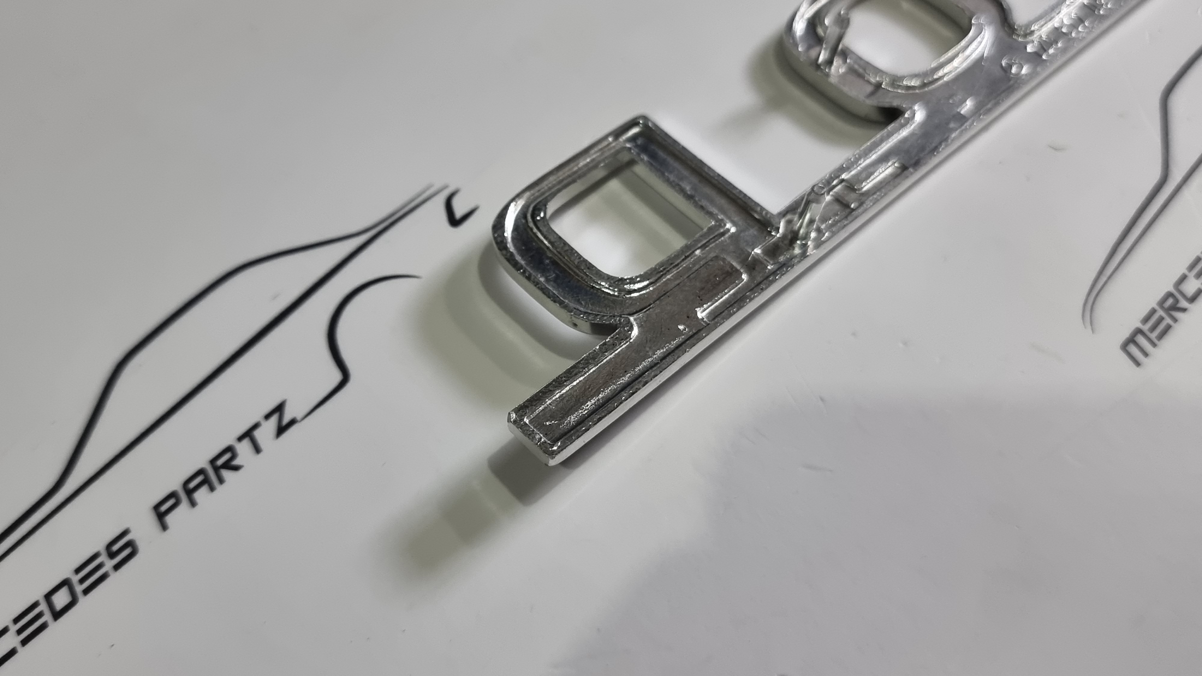 W123 300D trunk type designation emblem NOS A1238170915 - mercedespartz