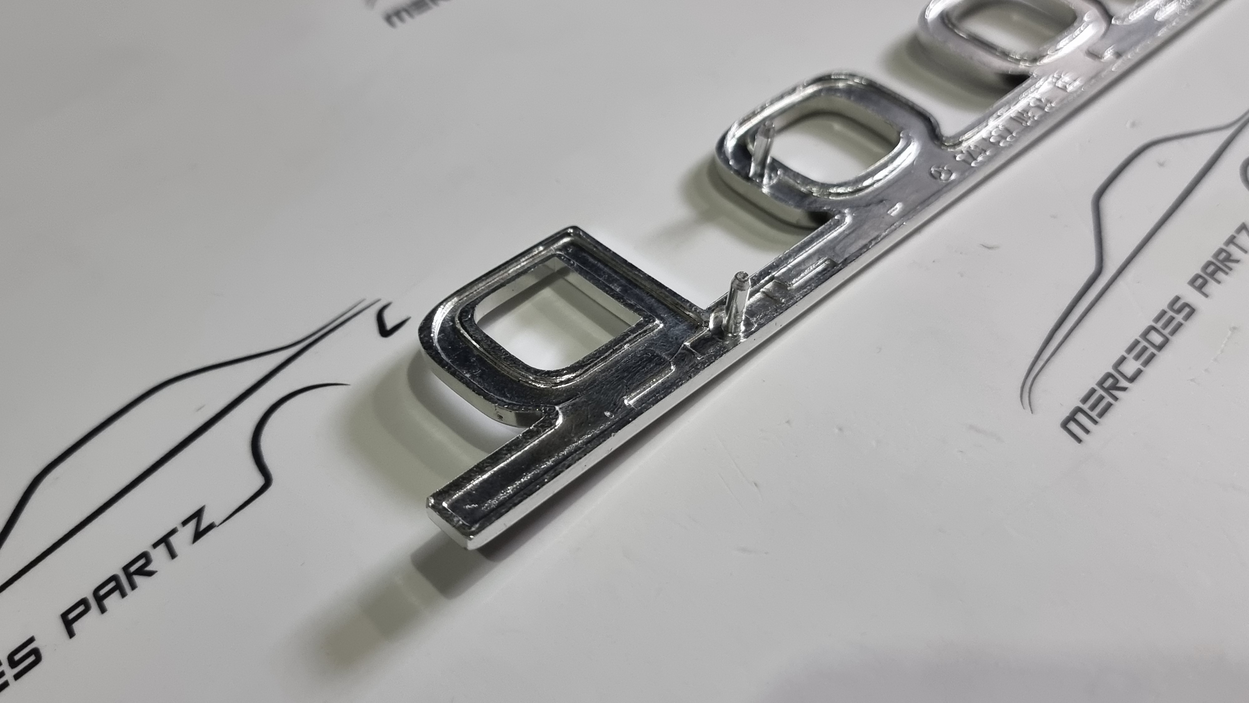 W123 300D trunk type designation emblem NOS A1238170915 - mercedespartz