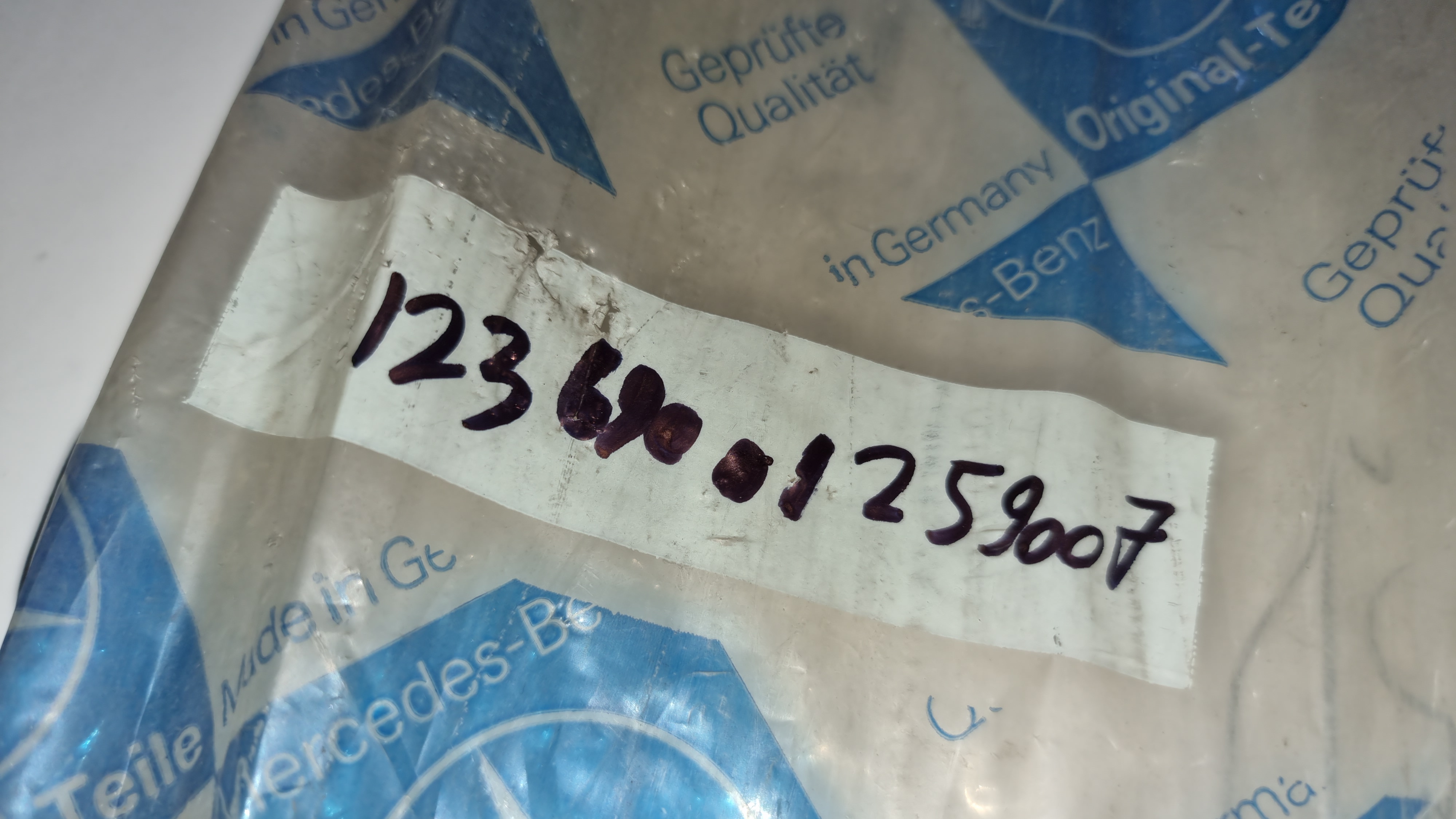 W123 left front cover paneling black NOS A12369001259007 - mercedespartz